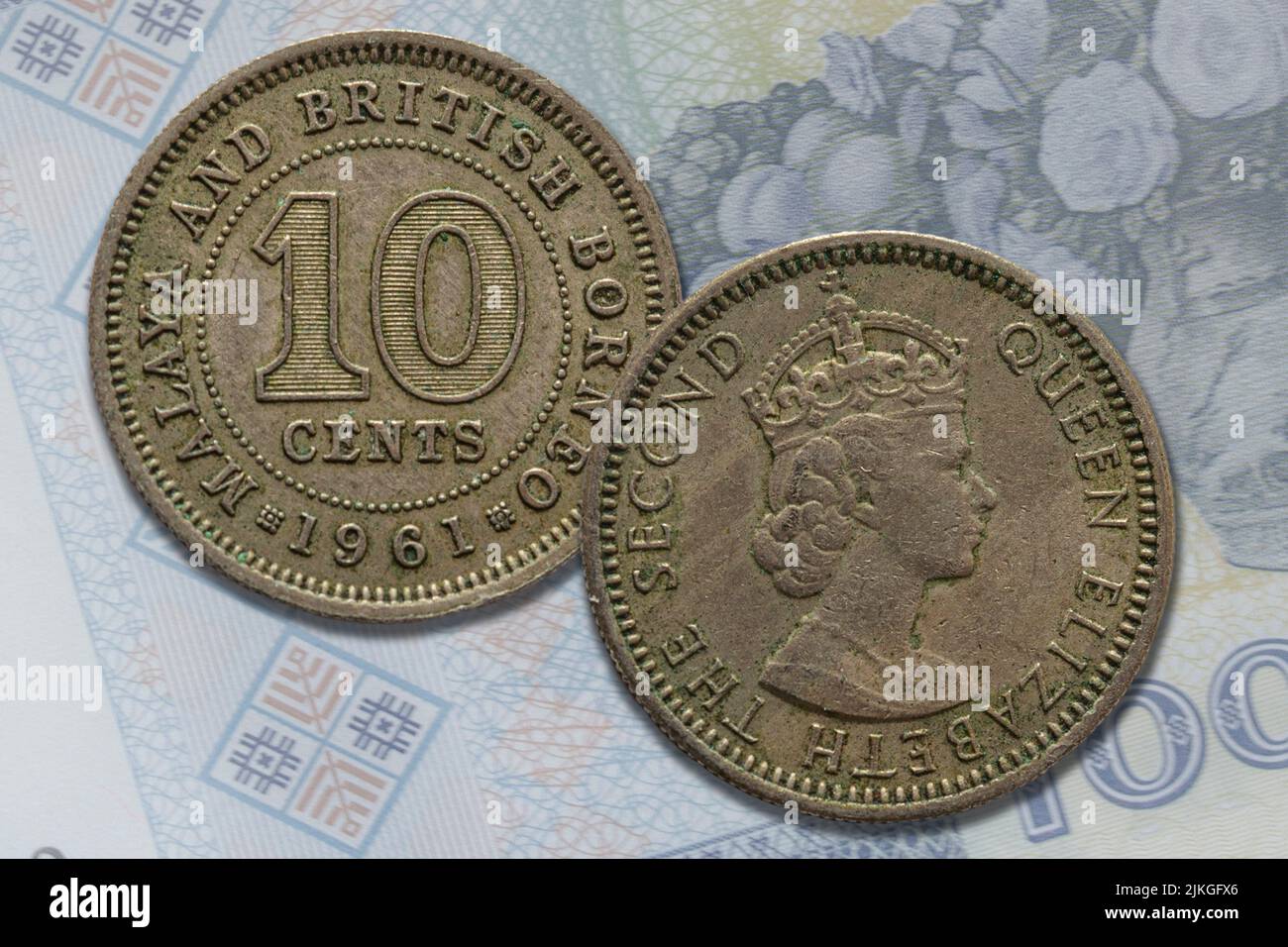 A top view closeup of British coins obverse and reverse on a paper ...