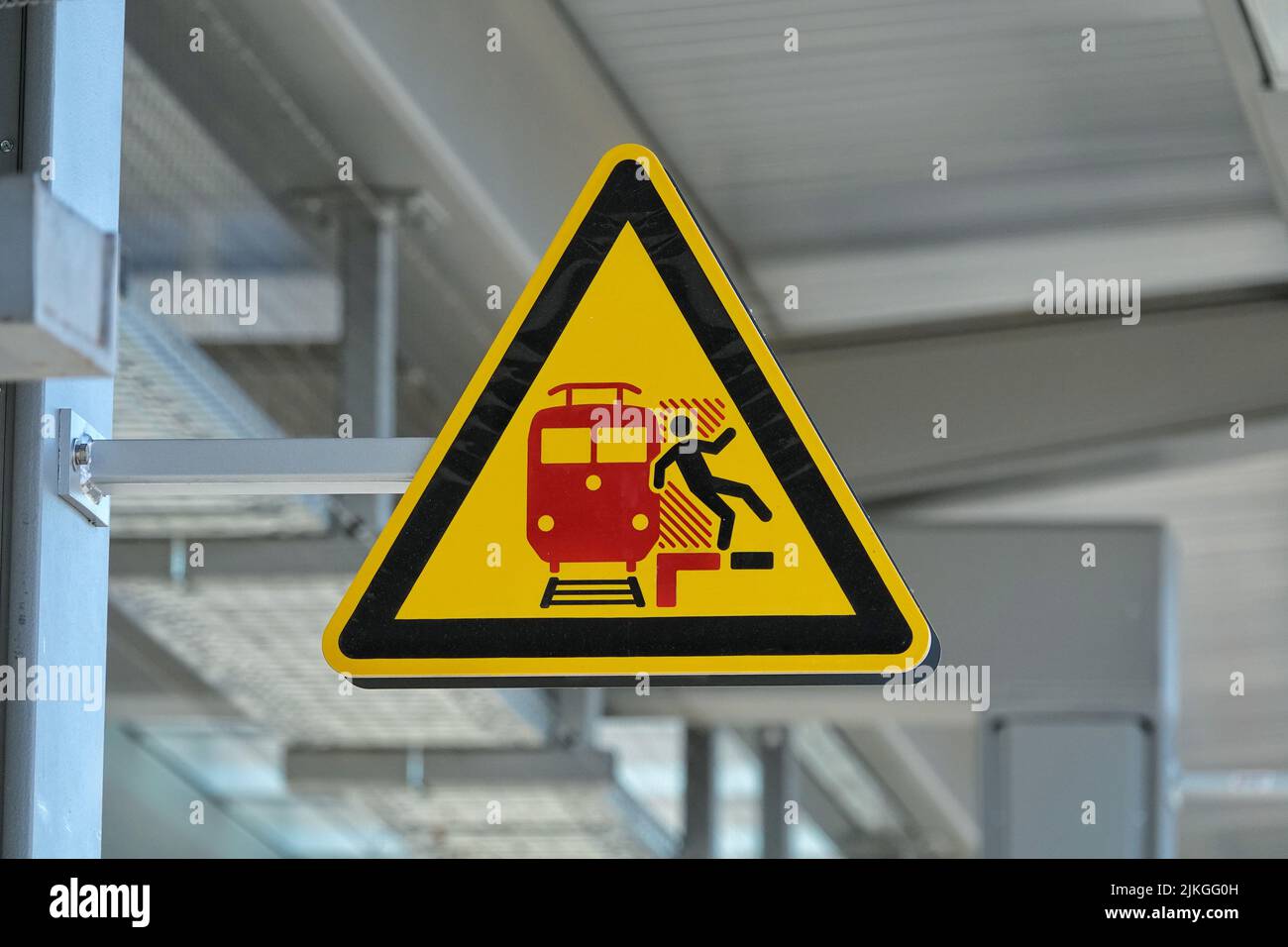 Picture shows a danger sign on the platform of a train station with ...