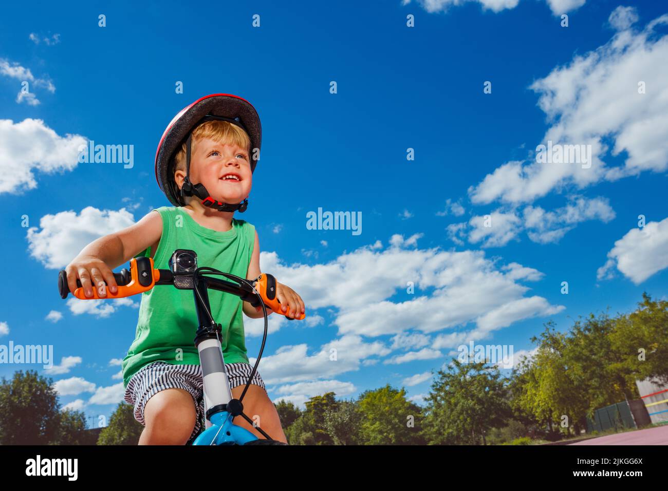 Little cute smiling boy ride small bicycle - low angle portrait Stock ...