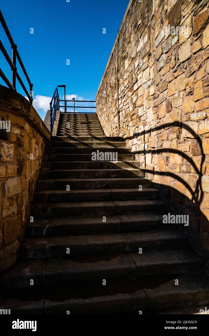 Stairs in shadow leading to a blue sky Stock Photo - Alamy