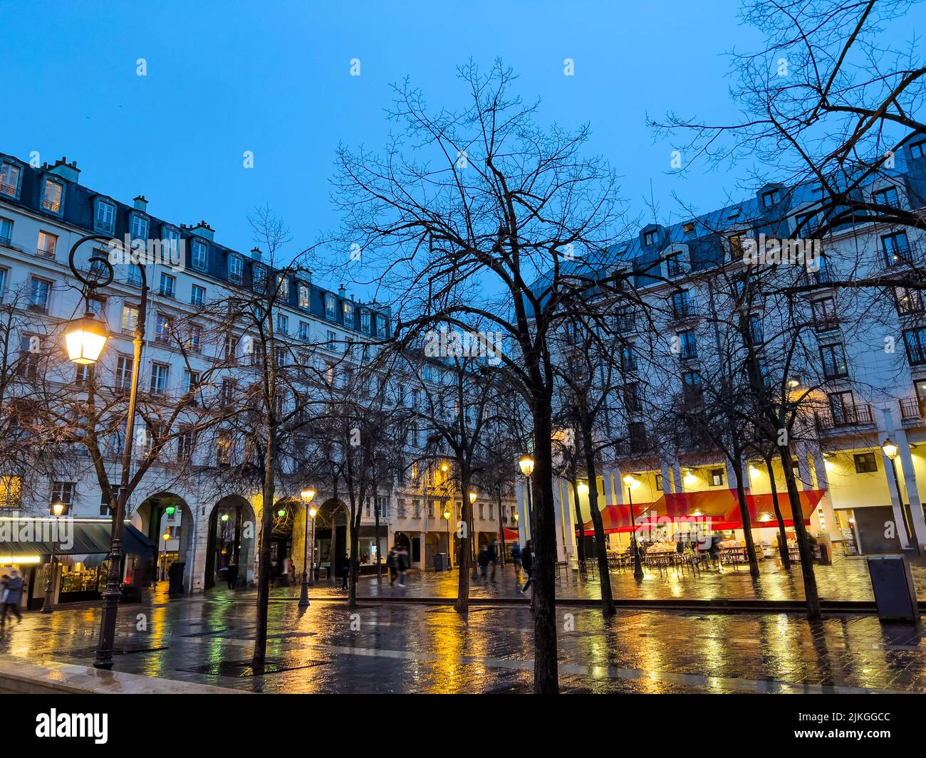 Joachim du Bellay square in rainy Paris at evening Stock Photo - Alamy