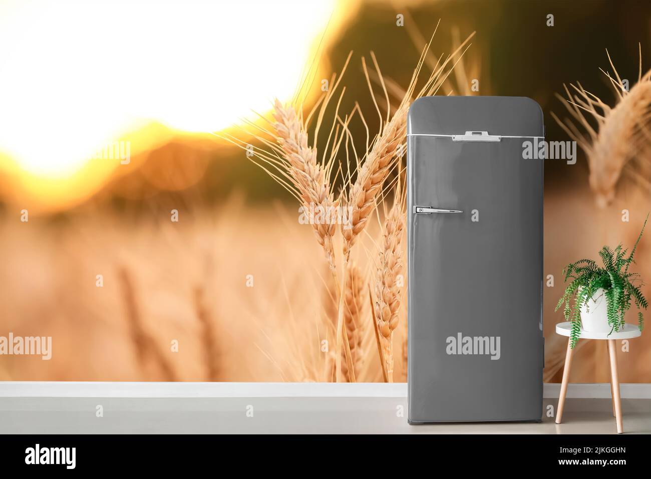 Stylish retro fridge near wall with print of wheat field Stock Photo ...