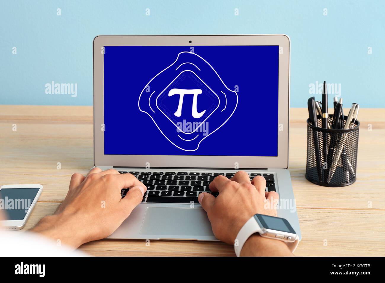 Man using laptop with letter Pi on screen Stock Photo - Alamy