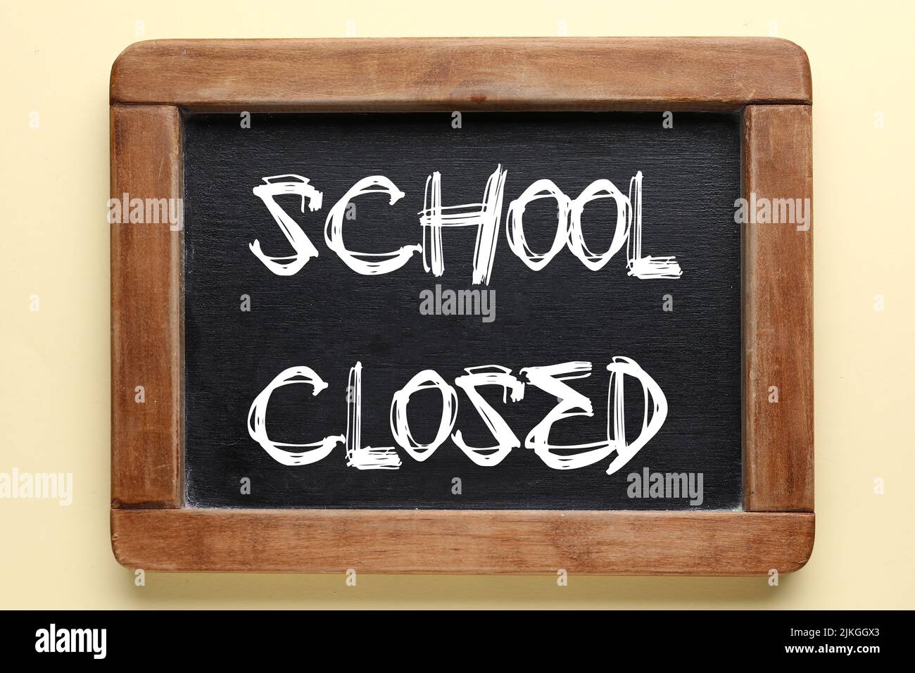 Chalkboard with written text SCHOOL CLOSED on light background Stock ...