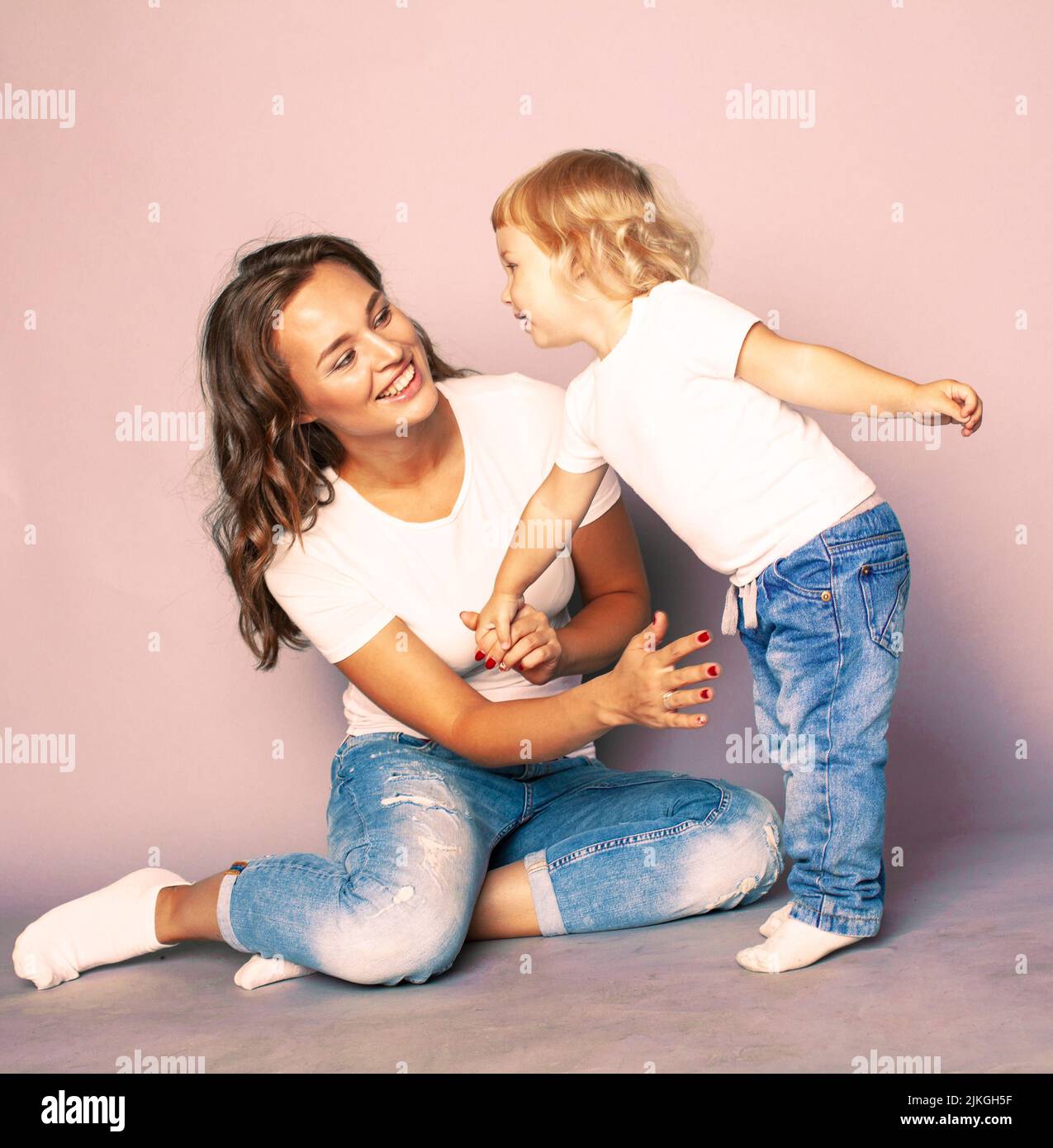 bright picture of hugging mother and daughter happy together, smiling ...