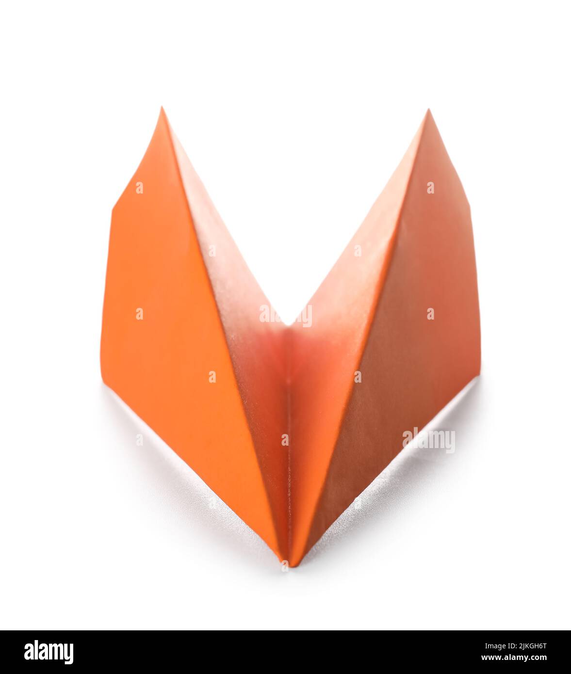 Orange paper plane on white background Stock Photo - Alamy