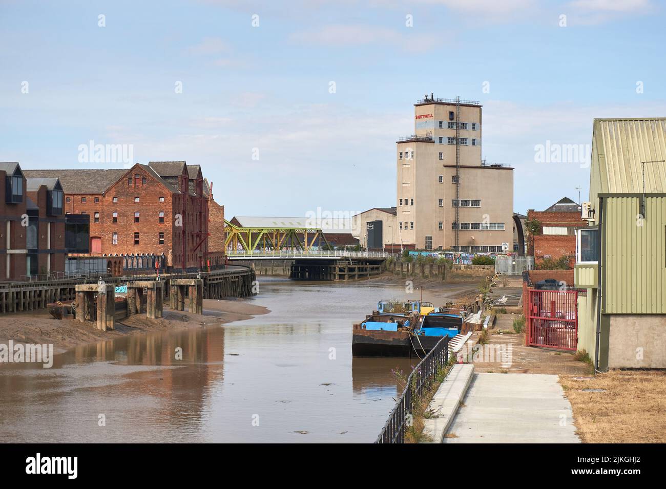 Barges moored in a tidal creek at low tide Stock Photo - Alamy