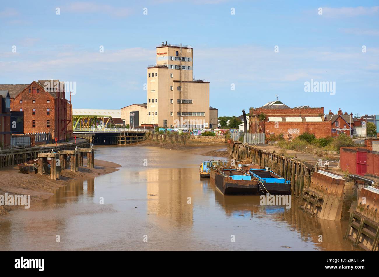 Barges moored in a tidal creek at low tide Stock Photo - Alamy