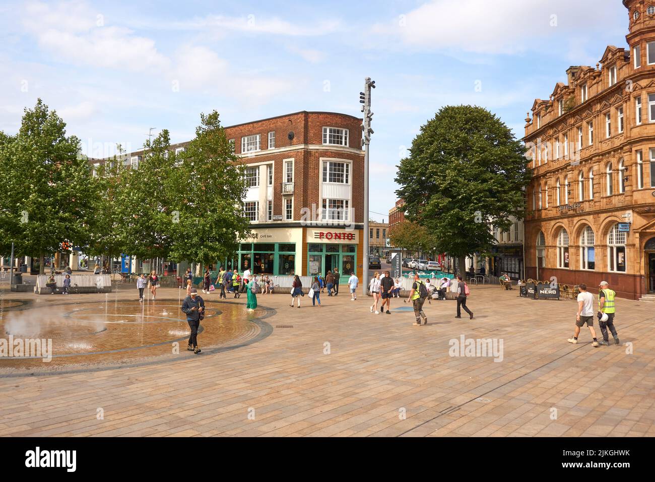 People near a water feature in Hull city center, UK Stock Photo - Alamy