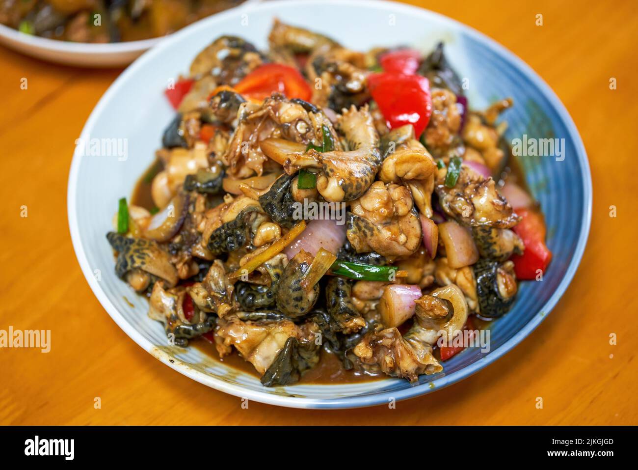 A delicious Chinese dish, fried bullfrog in sauce Stock Photo - Alamy