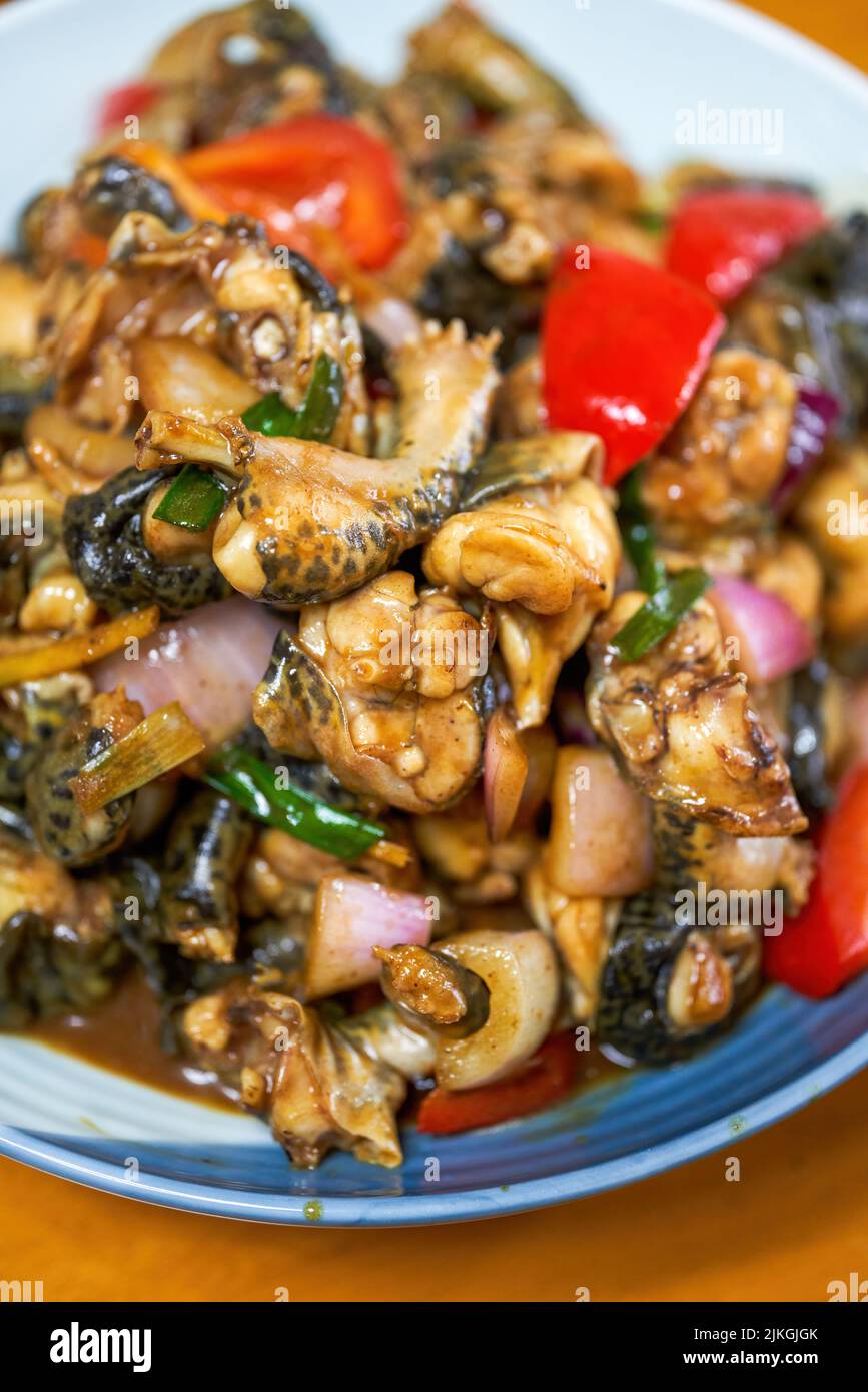 A delicious Chinese dish, fried bullfrog in sauce Stock Photo - Alamy