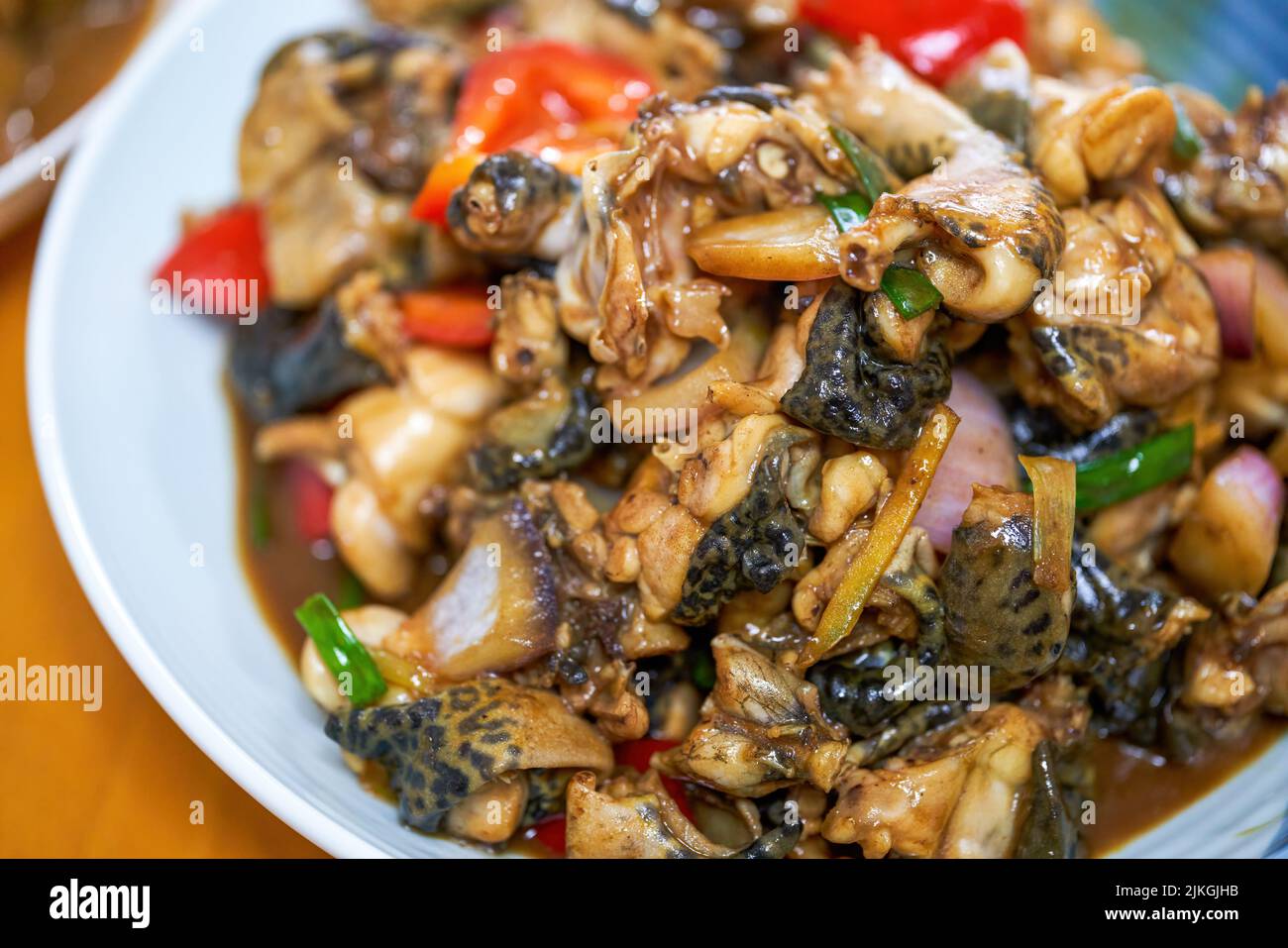 A delicious Chinese dish, fried bullfrog in sauce Stock Photo - Alamy