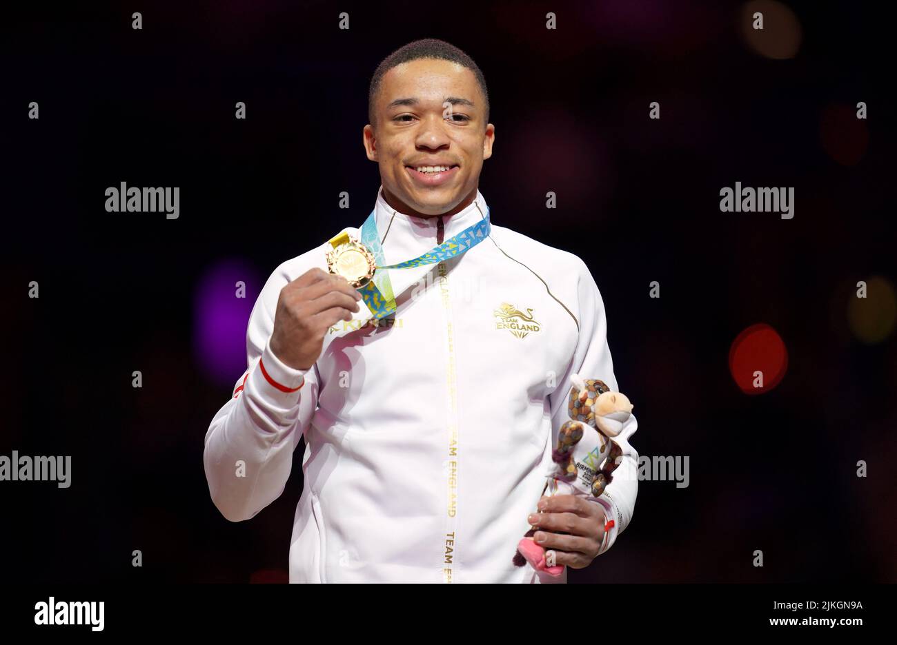 England’s Joe Fraser receives his gold medal for the Men's Parallel ...