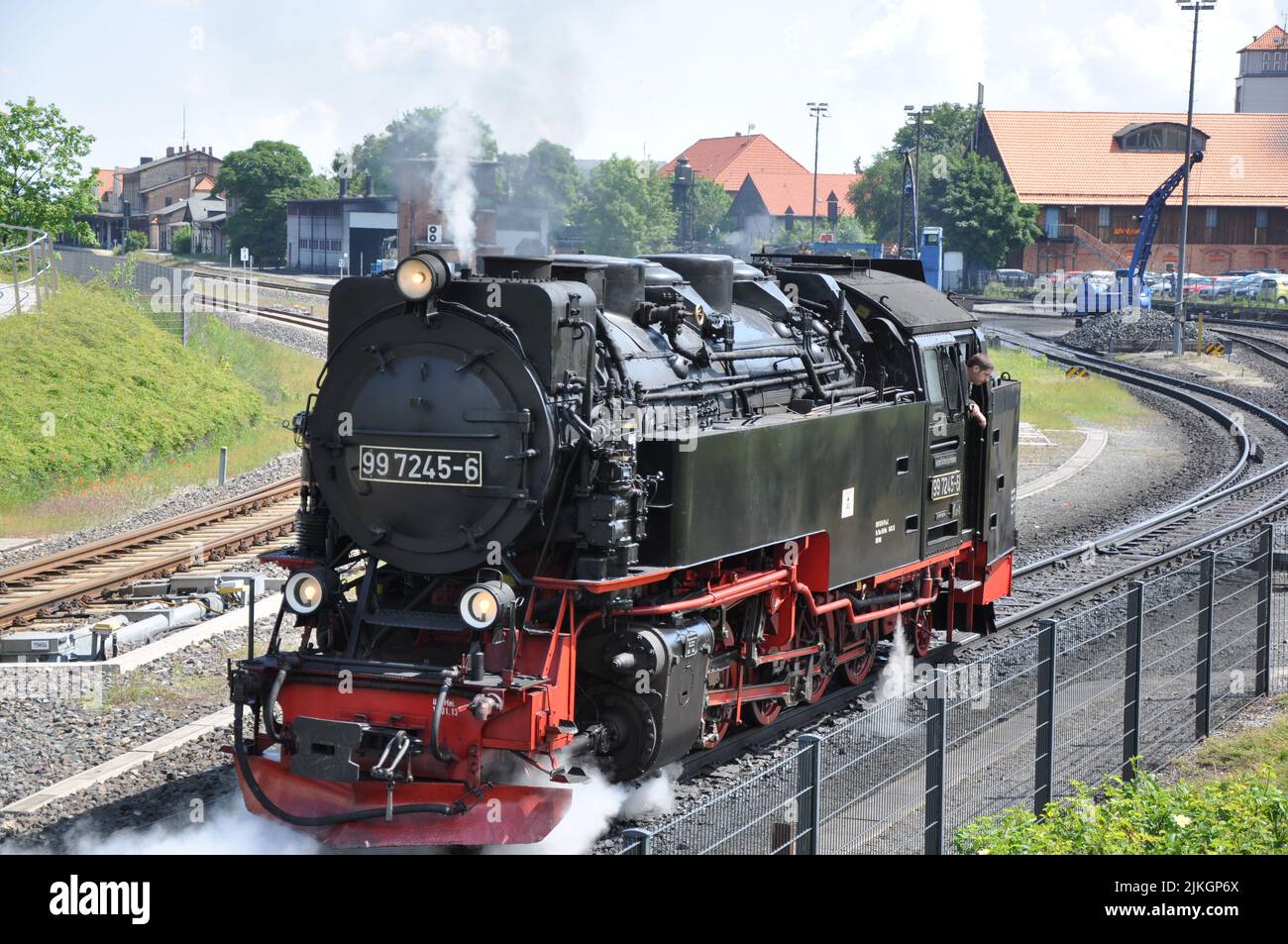 A steam locomotive with old wagons of Harzer Schmalspurbahnen at the ...