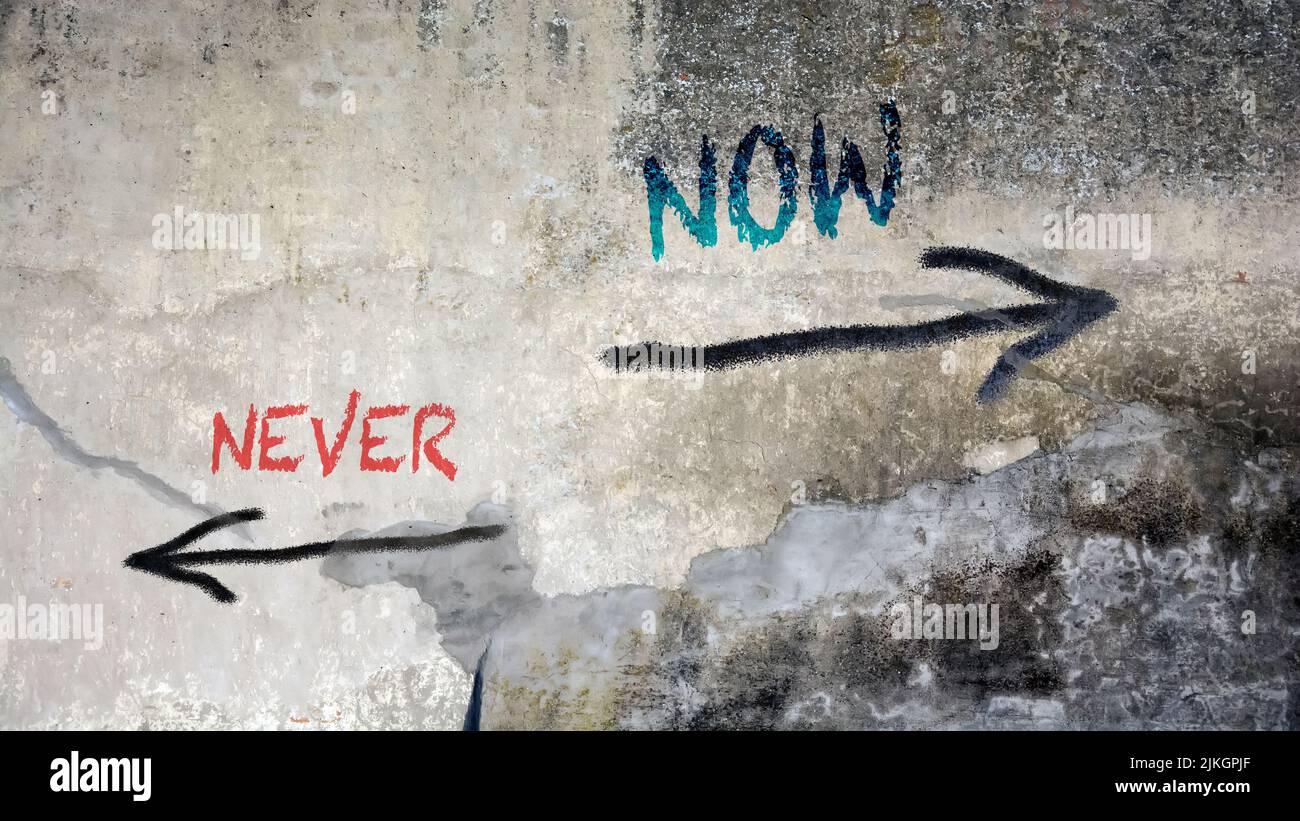 Street Sign the Direction Way to Now versus Never Stock Photo - Alamy