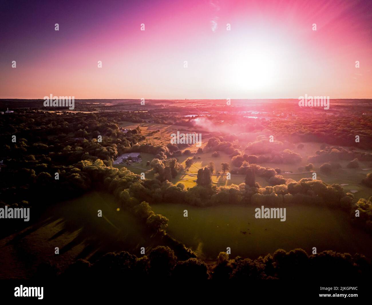 A beautiful aerial view of the countryside with dense forests at the ...