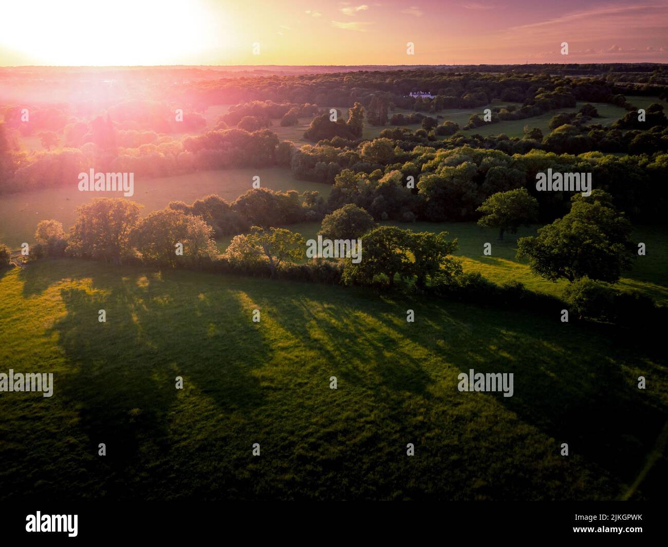 A beautiful aerial view of the countryside with dense forests at the ...