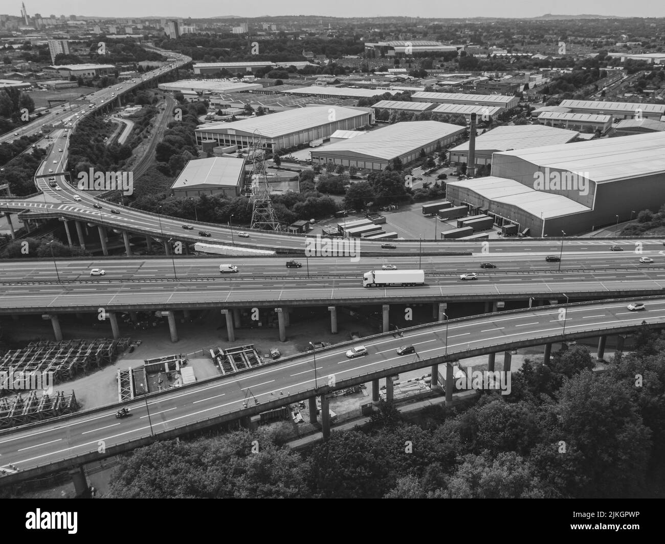 An aerial view of a complex motorway road junction with traffic in ...