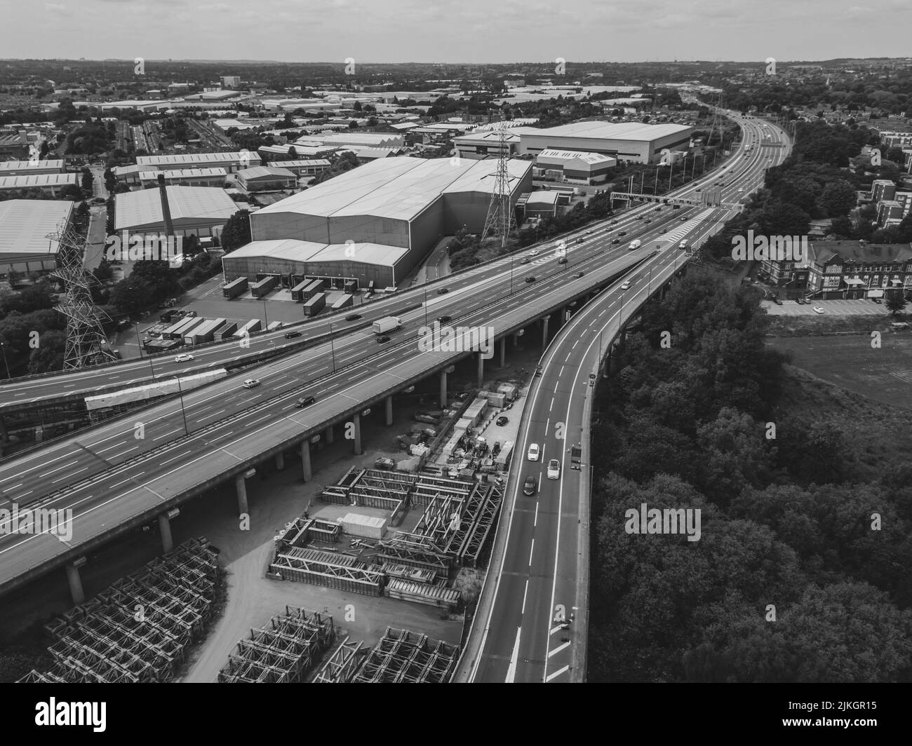 An aerial view of a complex motorway road junction with traffic in ...