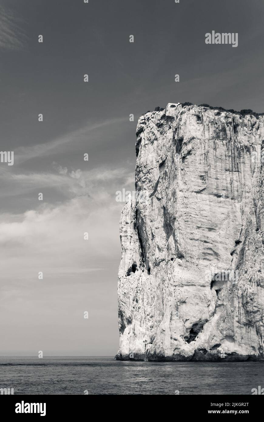 A grayscale shot of a huge cliff in Sardinia, Italy Stock Photo - Alamy