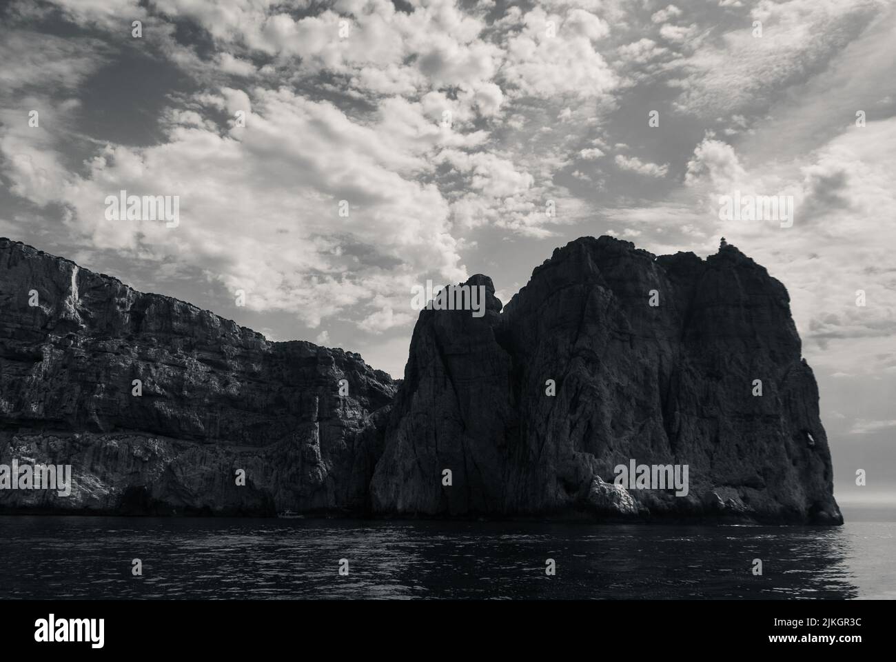 A grayscale shot of a huge cliffs in Sardinia, Italy Stock Photo - Alamy