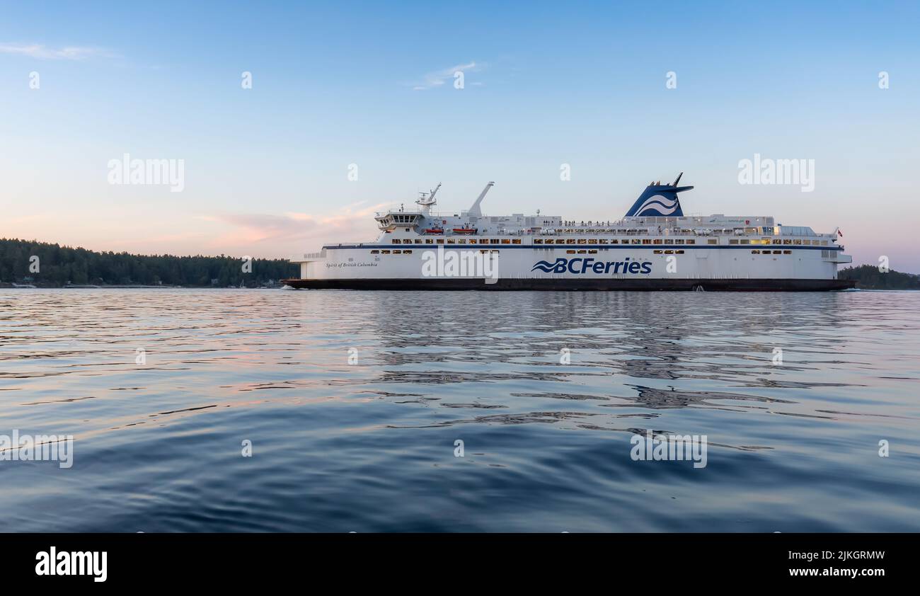 BC Ferries Boat leaving the Terminal in Swartz Bay during colorful ...