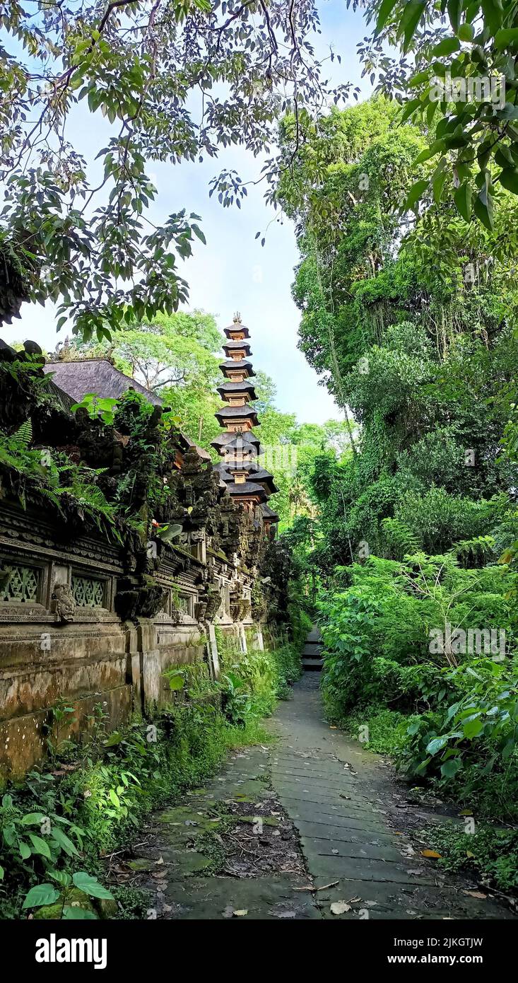 A vertical of a wall of the Pura Gunung Lebah temple with a multi ...