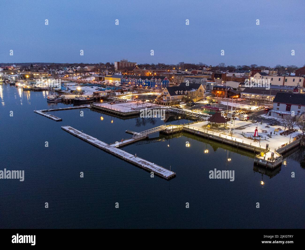 An aerial view of boats and yachts port and city at night Stock Photo ...