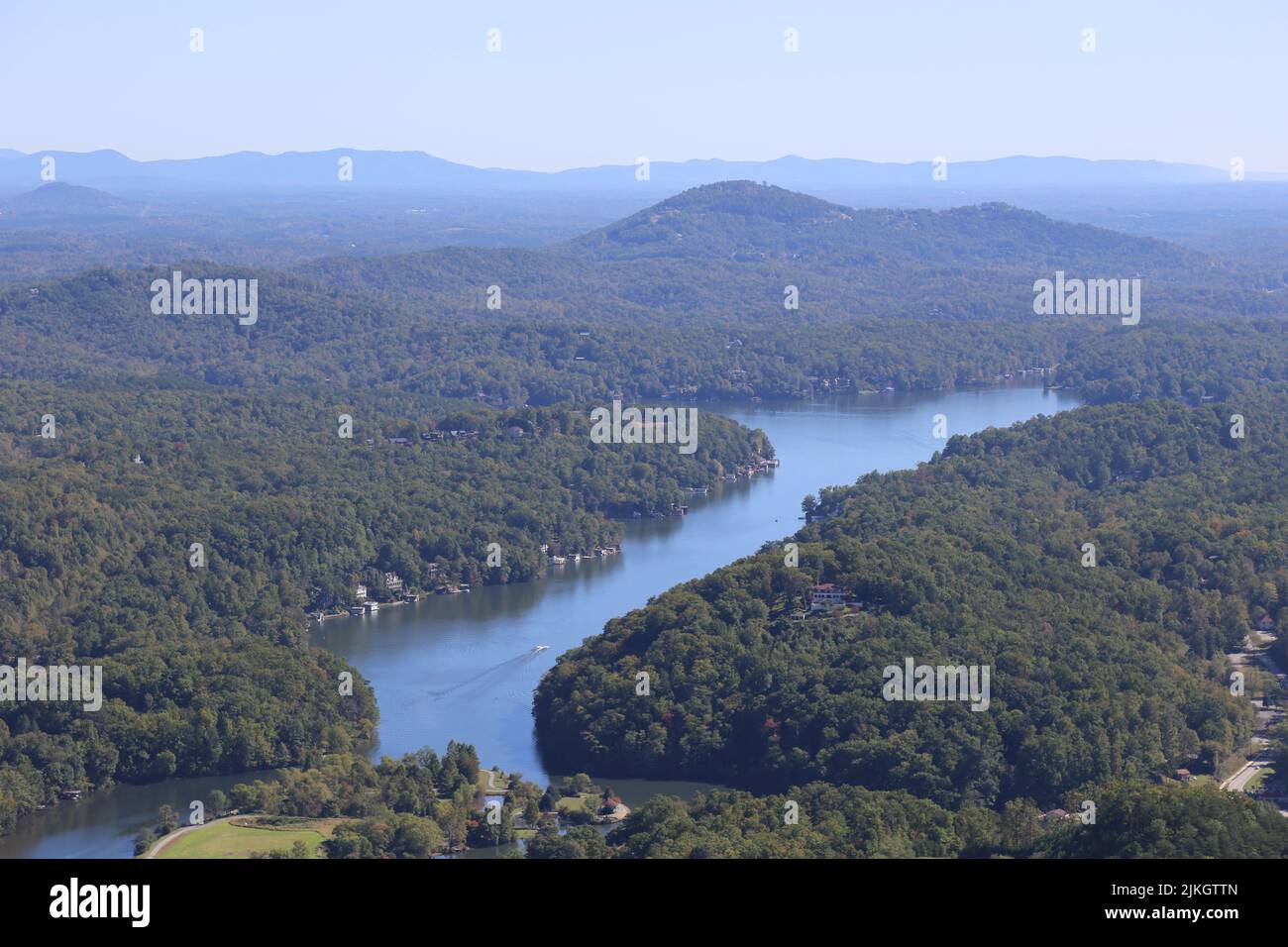 A high angle view of a beautiful river flowing in the forest near the ...