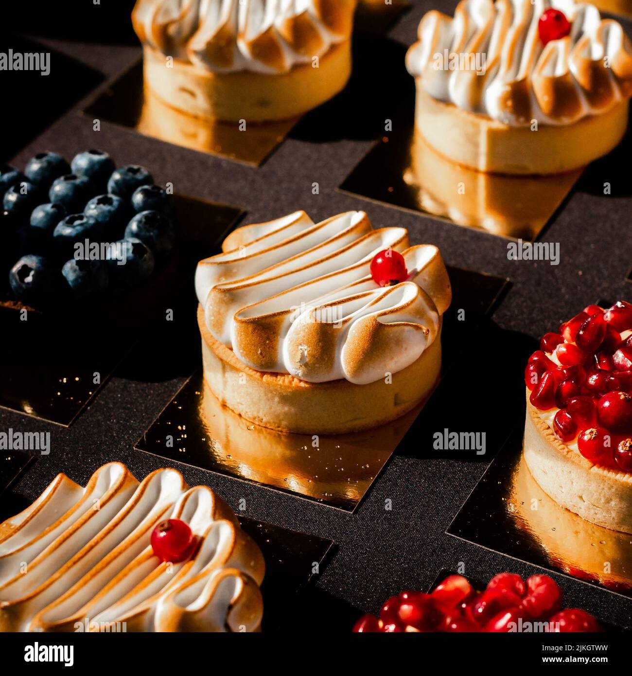 The close-up of tart with fried meringue and a cranberry on a top Stock ...
