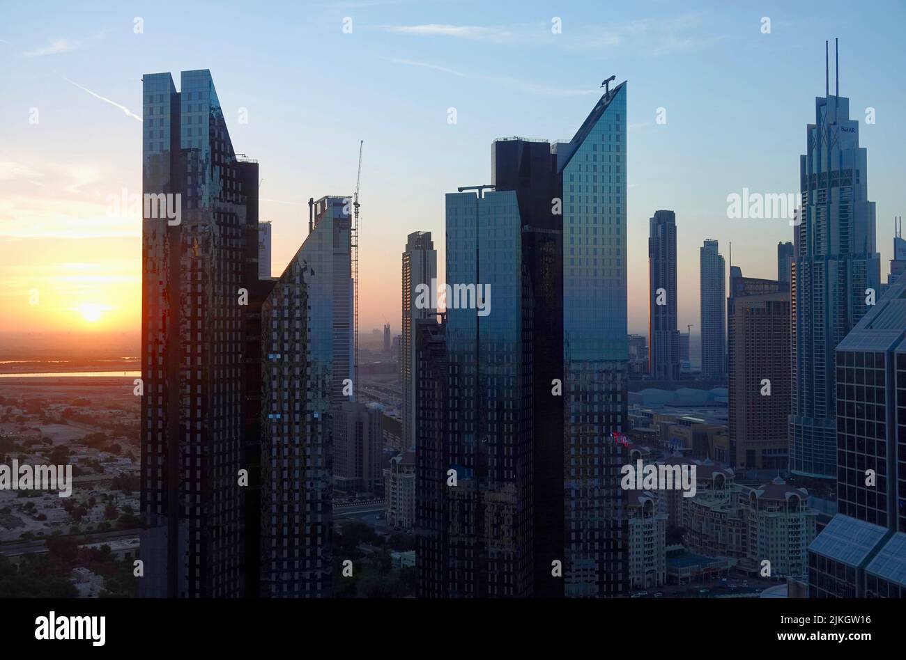 A high-angle view of the high-rise skyline in Dubai, UAE during sunrise ...