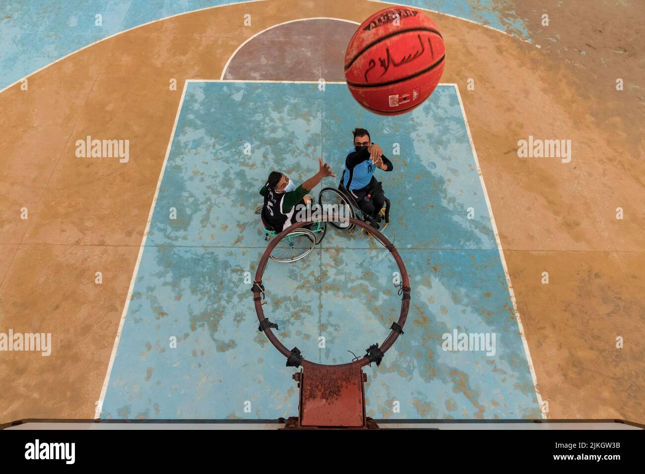 An overhead shot of people with disabilities playing basketball Stock ...