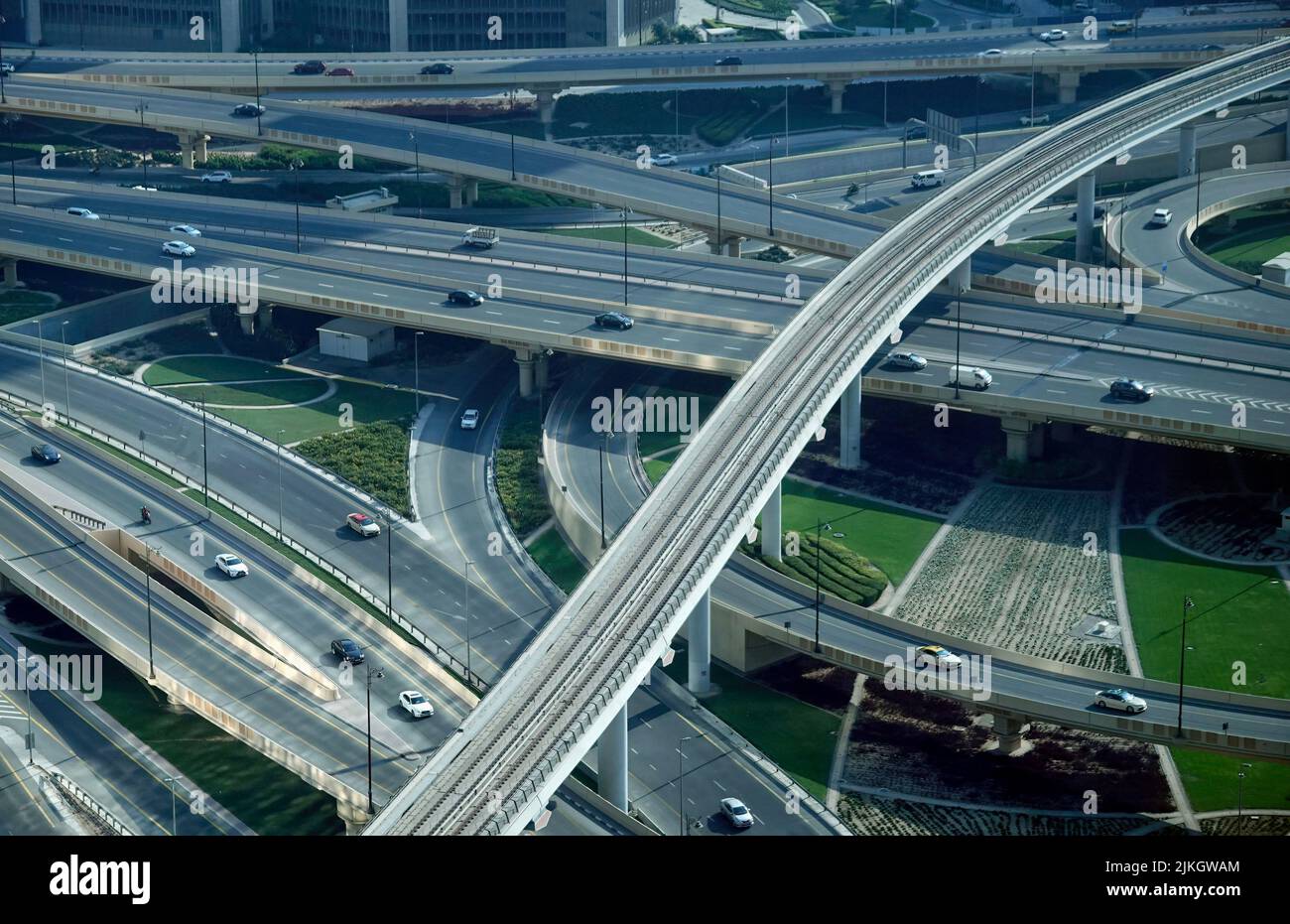 An aerial view of the metro line crossing a network of roads in Dubai ...