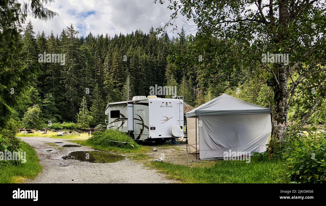 Motorhome and tent camping at a remote forestry campsite on a cold ...