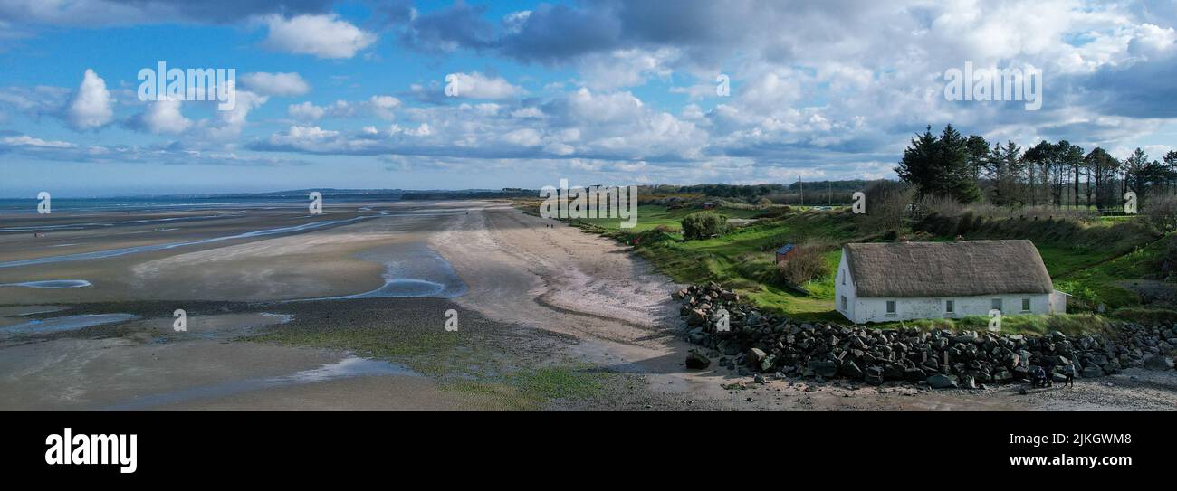 A panoramic view of a white cottage in a rural area in Laytown village ...