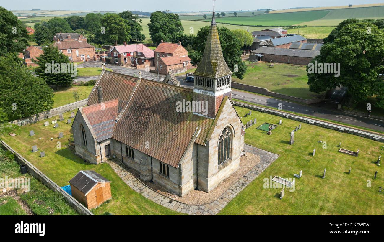 An aerial view of Village Church surrounded by cemetery and greenery ...