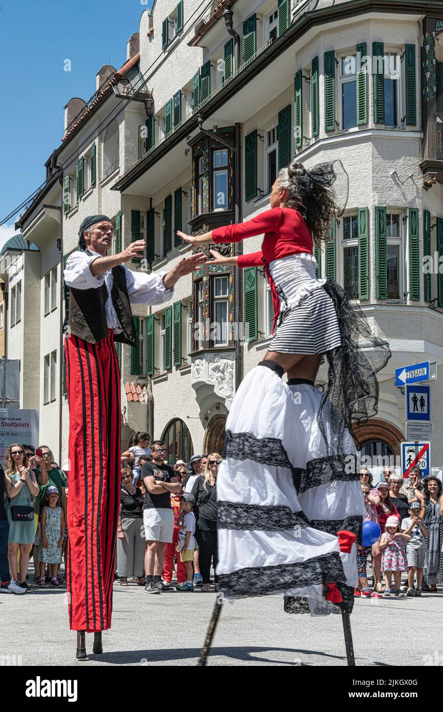 Street Artists performing on Stilts in the historic Center of Kufstein ...