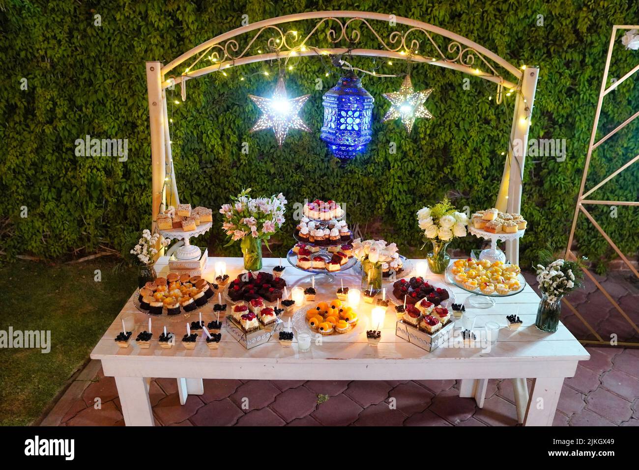 A decorated table with plates of cakes at a wedding reception Stock ...