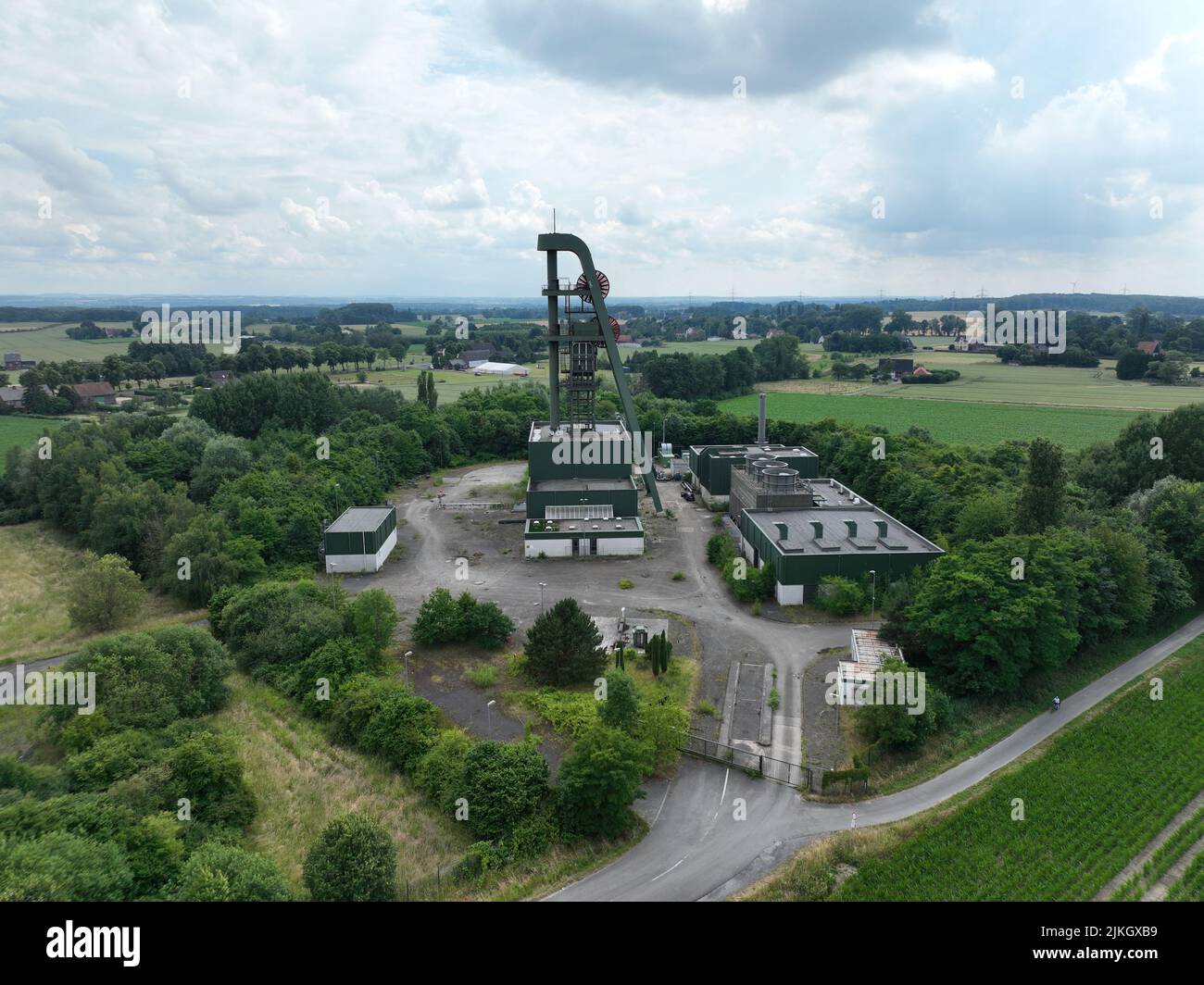 An aerial view of an old mining building in the middle of a scenic ...