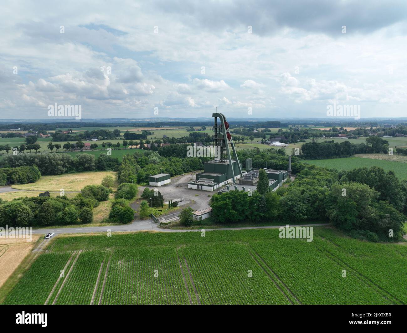 An aerial view of an old mining building in the middle of a scenic ...
