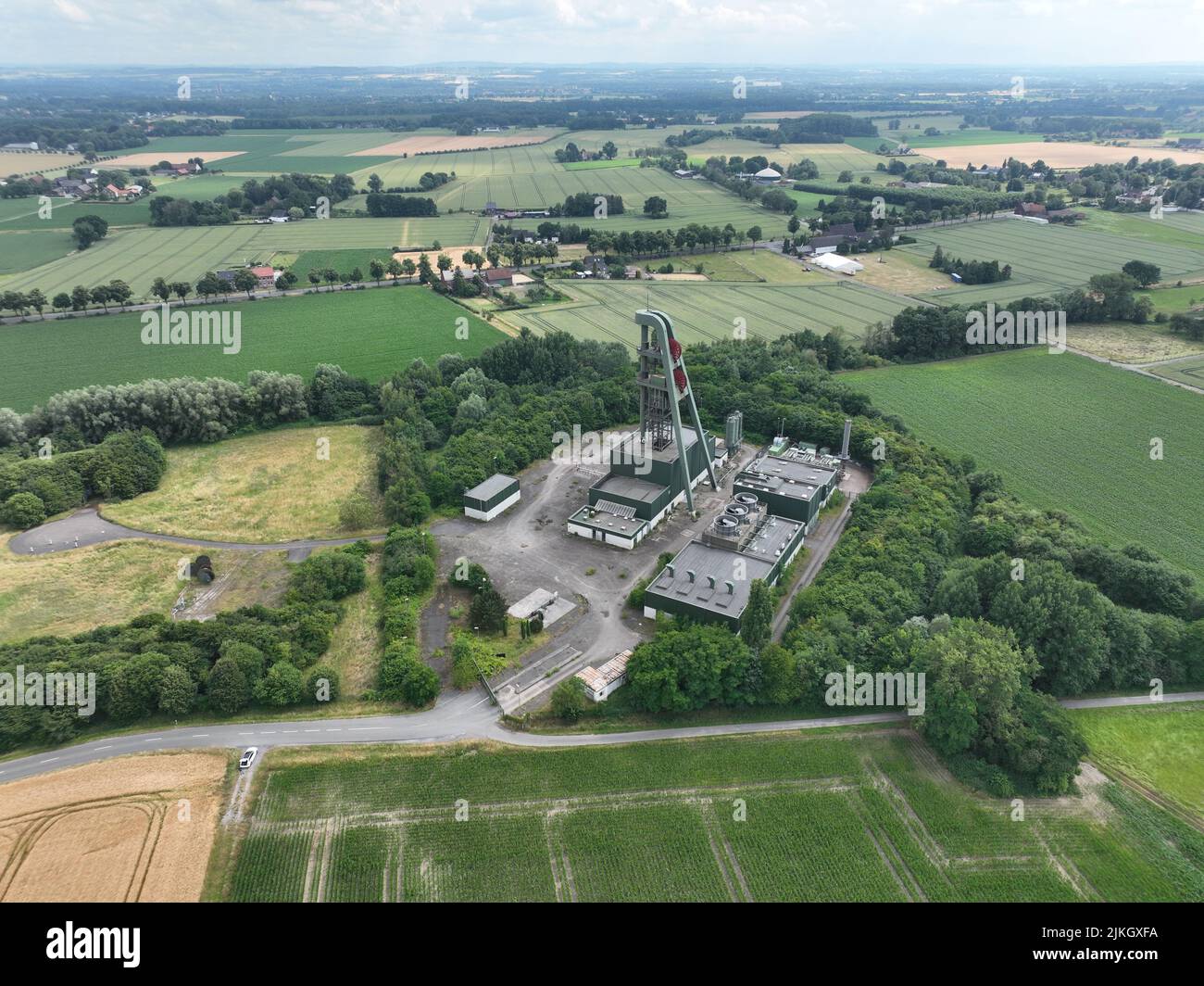An aerial view of an old mining building in the middle of a scenic ...