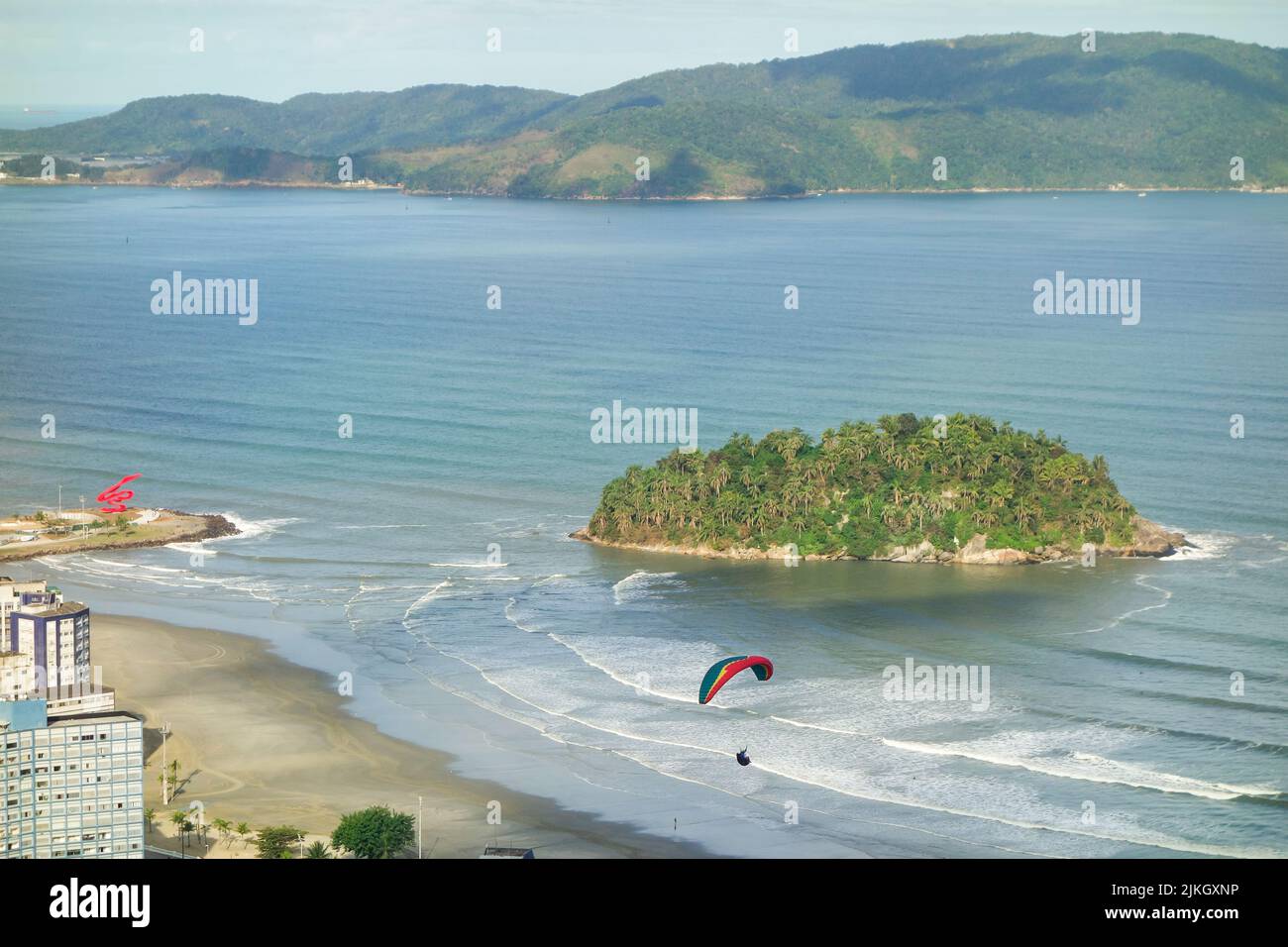 paraglider flying above Santos city beach in Brazil Stock Photo - Alamy