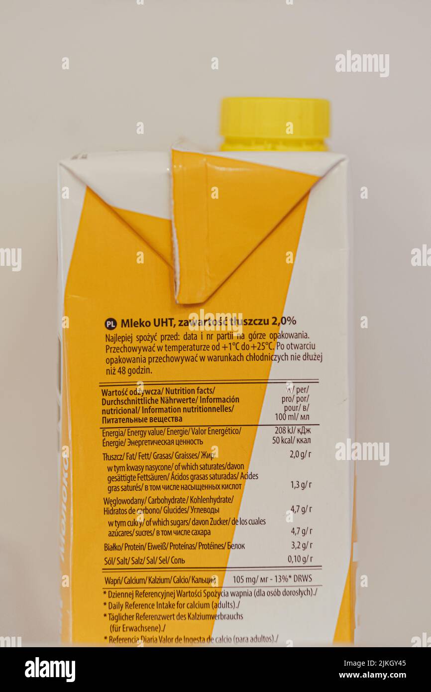 A vertical shot of a Polish Mlekovita brand milk pack showing energetic ...