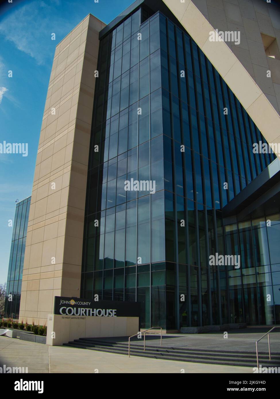 A vertical shot of a modern glass building of a Johnson County ...