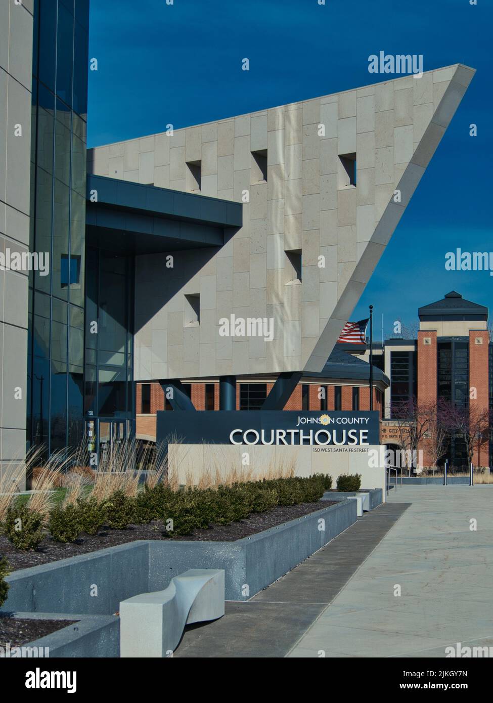 A vertical shot of a modern glass building of a Johnson County ...