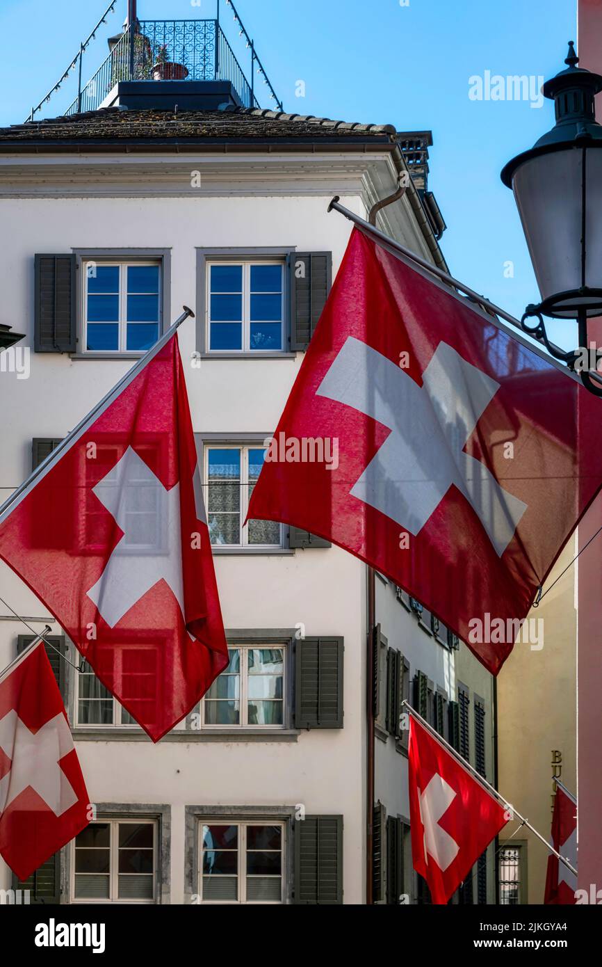 Historical houses and facades with swiss flags in the old town of ...