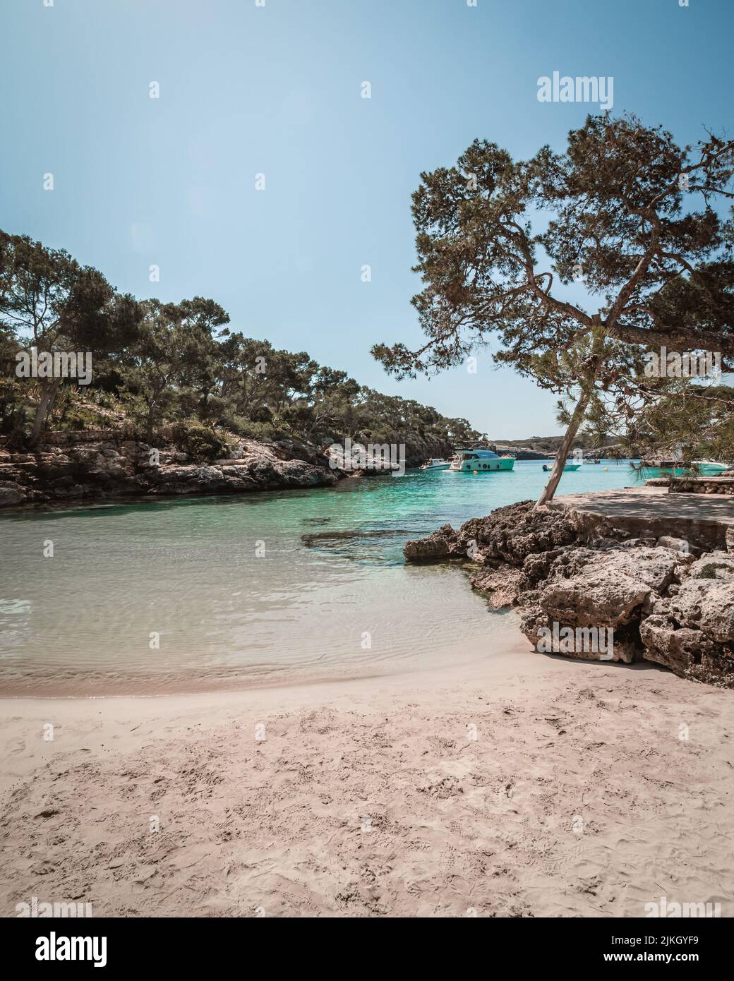 A beautiful view of a beach Cala Mitjana, Mallorca under the clear sky ...