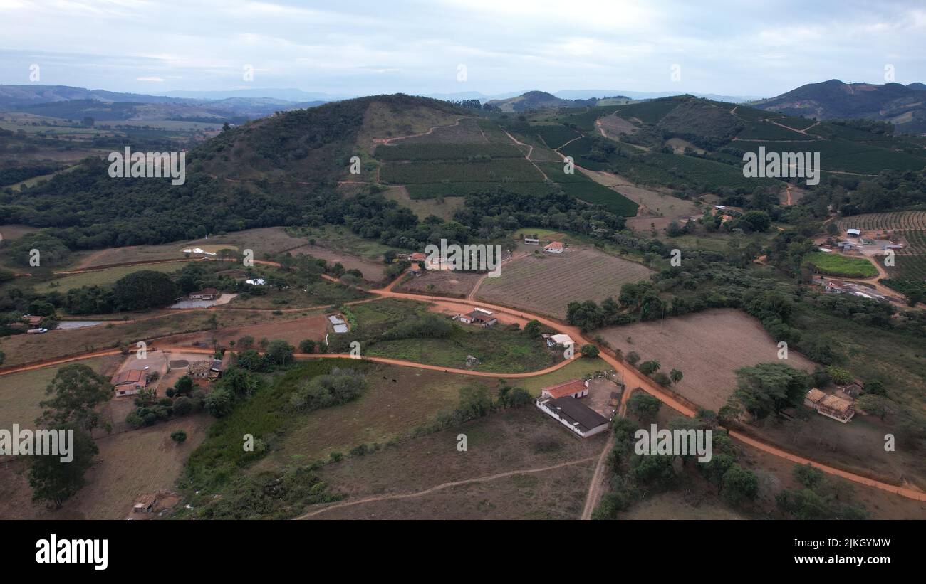 An aerial shot of a mountain with green coverage and a path Stock Photo ...