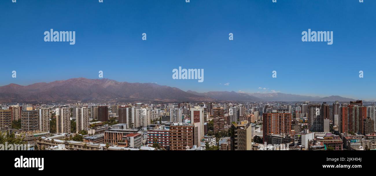 A panoramic of the Santiago City surrounded by the Andes mountain range ...