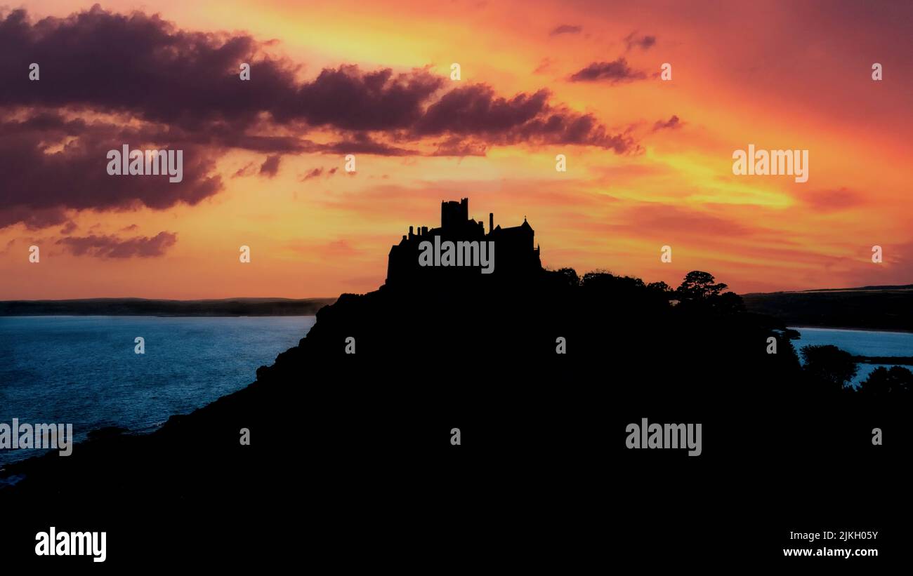 The beautiful sunset with a silhouette of a castle, St Michael's Mount ...